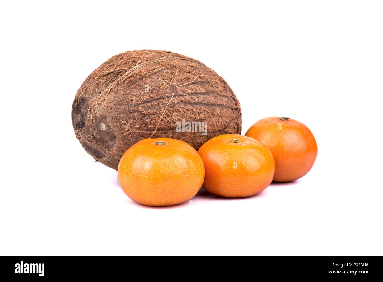 Fruit coconut and three ripe mandarin on a white background Stock Photo ...