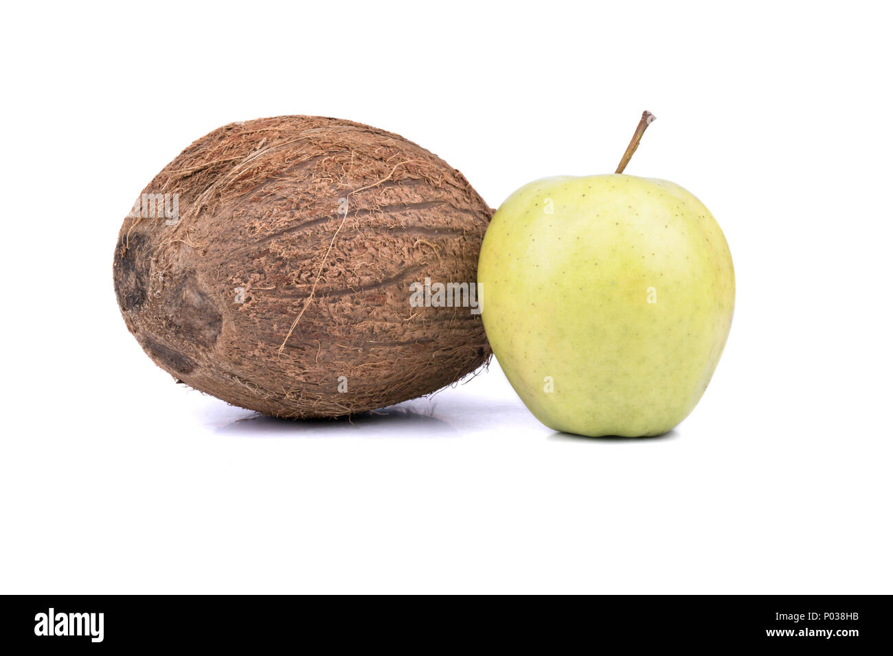Coconut fruit and green apple on a white background Stock Photo - Alamy