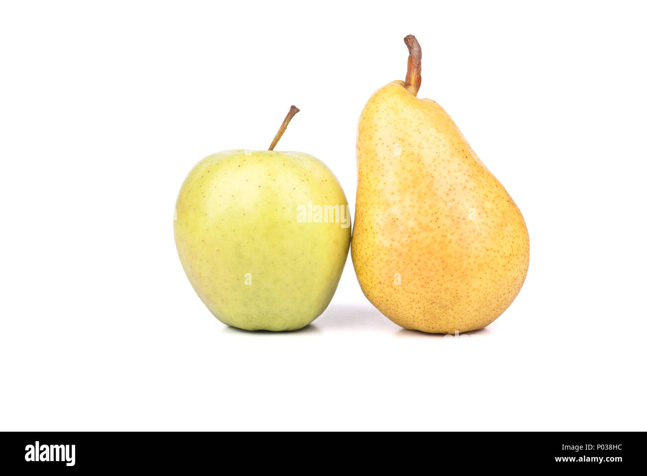 Fruits yellow pear and green apple on a white background Stock Photo ...