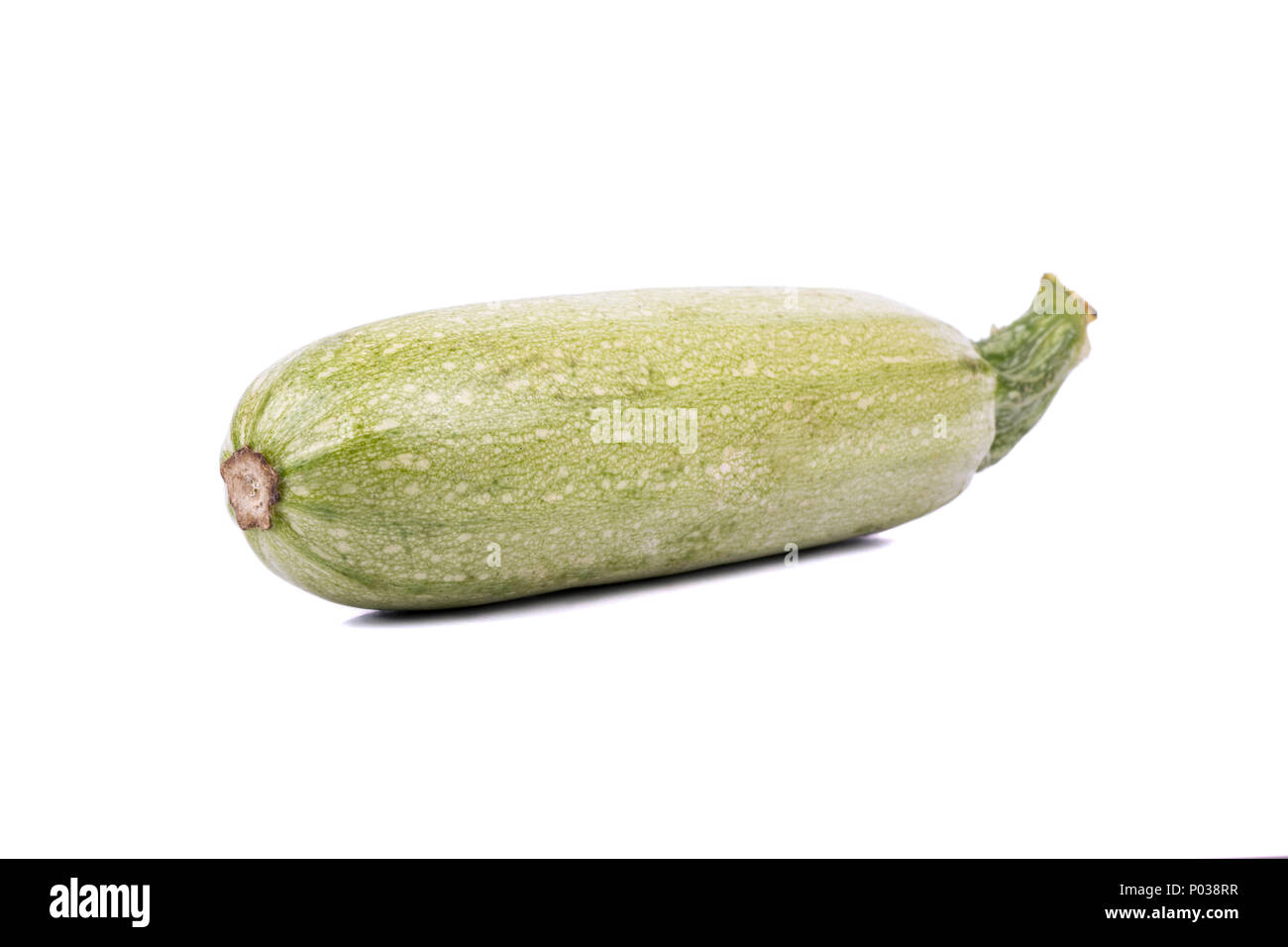 One green vegetable marrow on a white background Stock Photo - Alamy