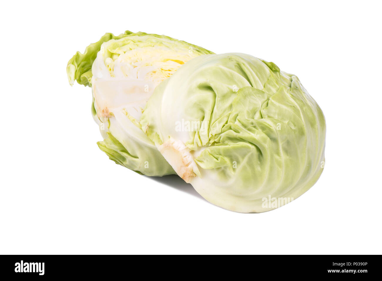 Cabbage cut into two halves on a white background Stock Photo - Alamy