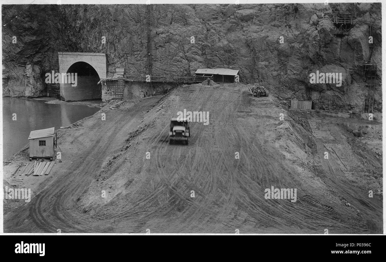 Temporary diversion dike being constructed upstream from cofferdam ...