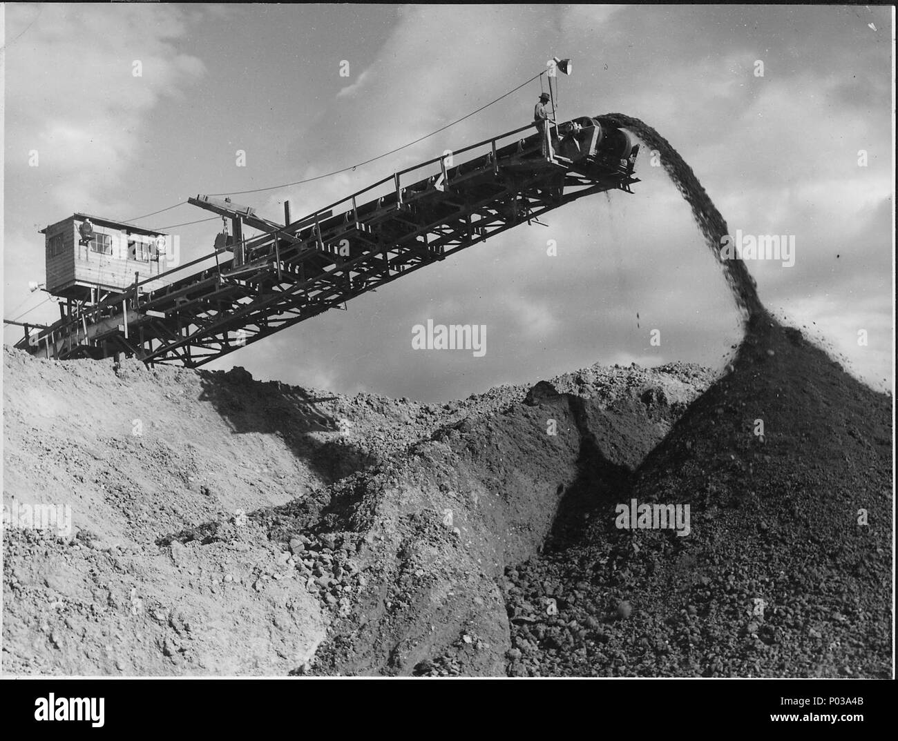 The 175-foot boom of the conveyor stacker section discharging material ...