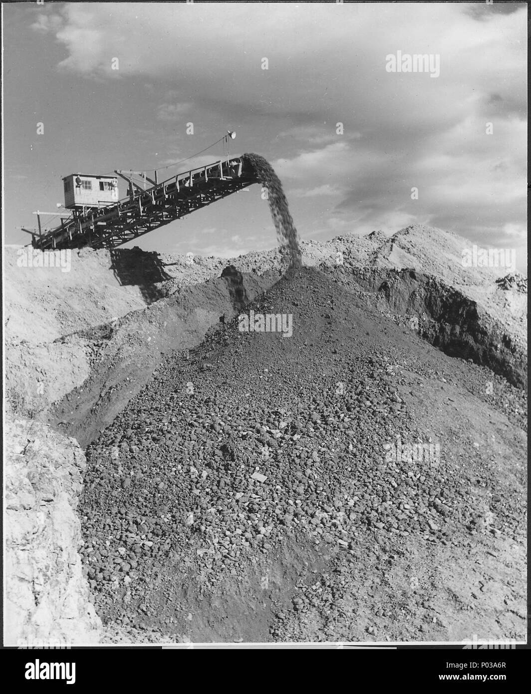 The 175-foot boom of the conveyor stacker section discharging material ...