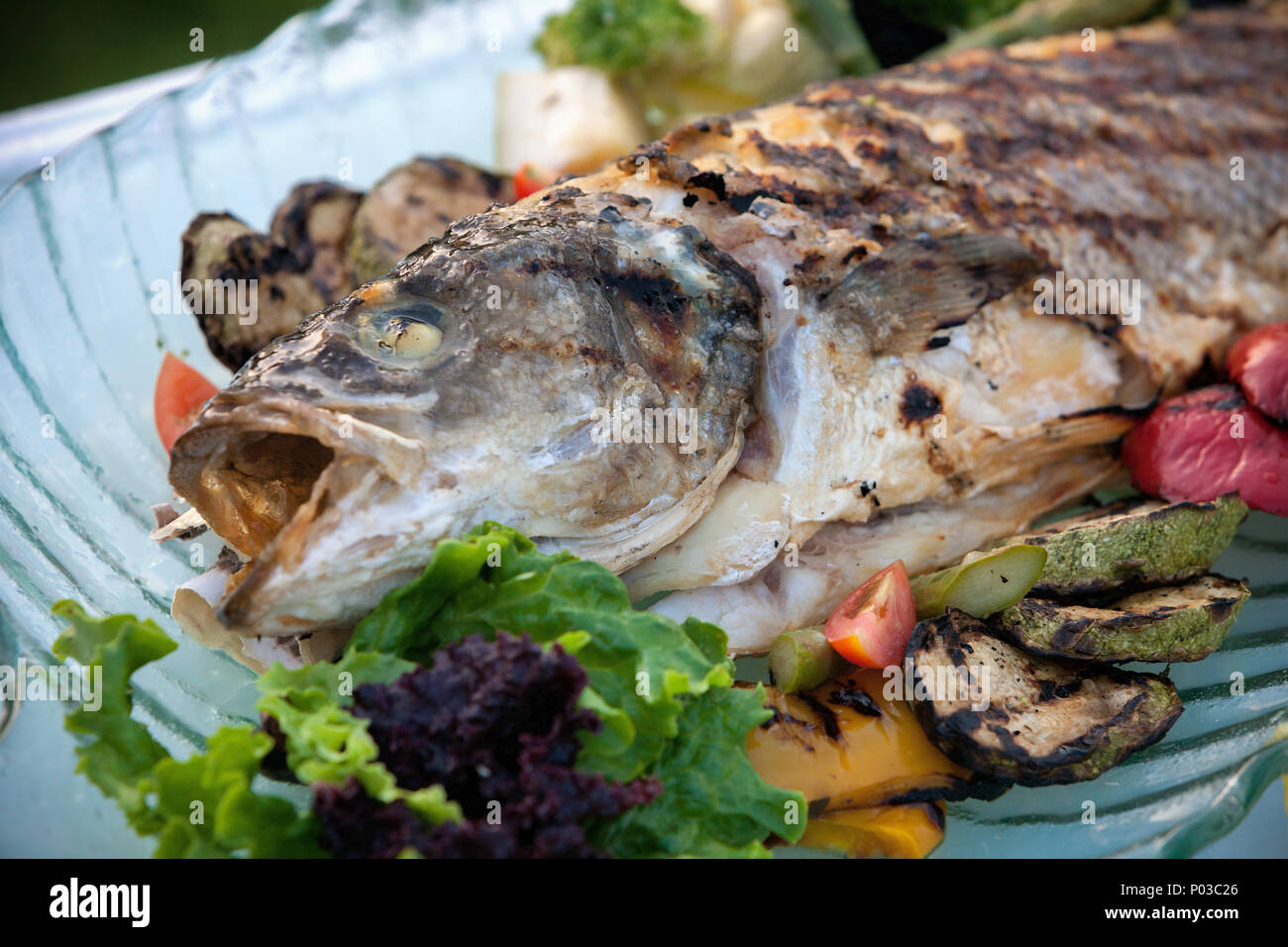 grilled fish with roasted vegetables Stock Photo - Alamy