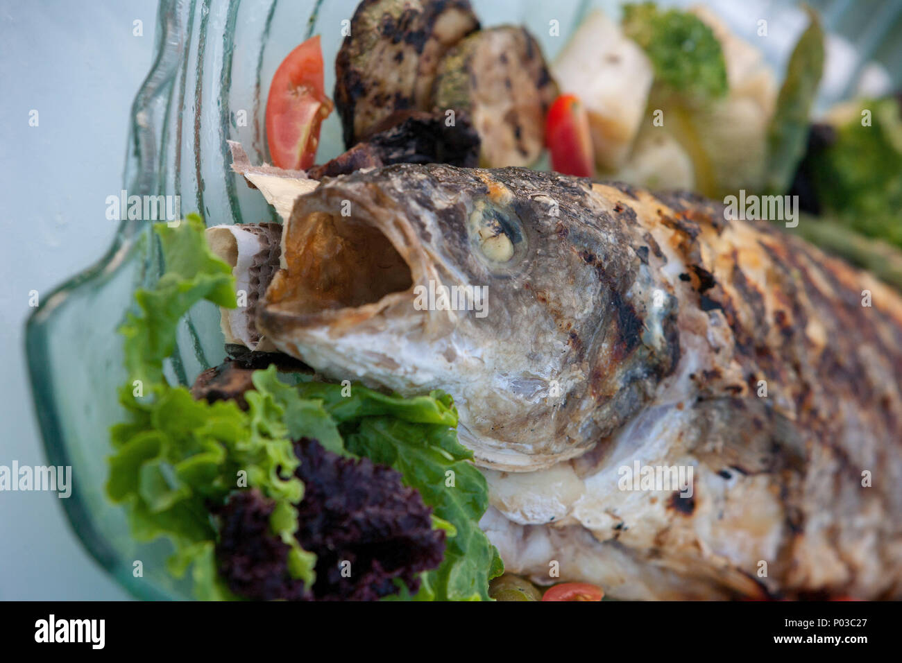 grilled fish with roasted vegetables Stock Photo - Alamy