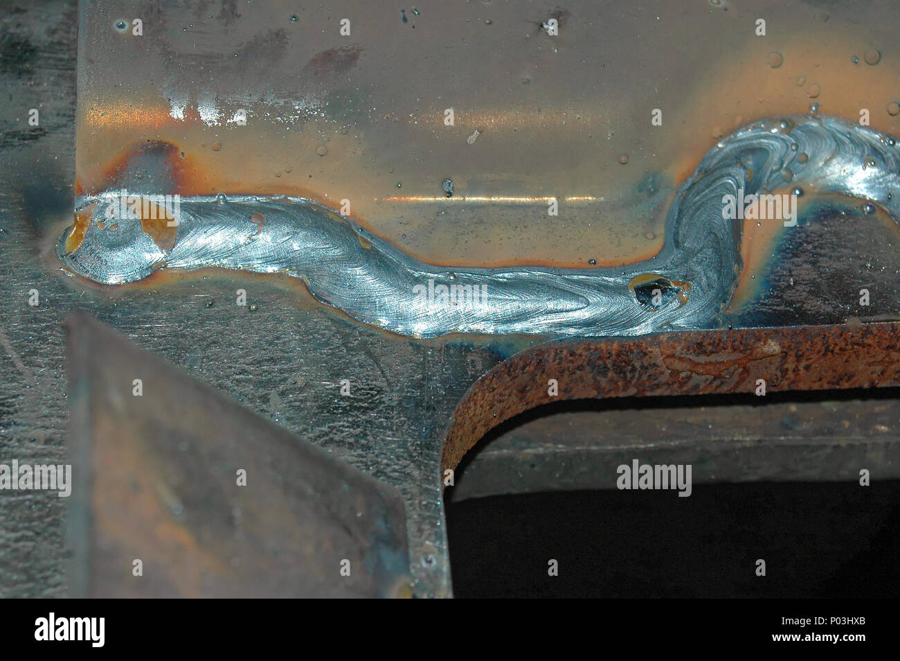 Close up of raw nonlinear welding joint of carbon steel with visible ...