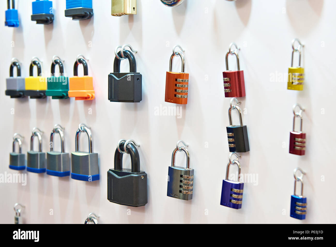 Padlocks on the wall of the store Stock Photo - Alamy