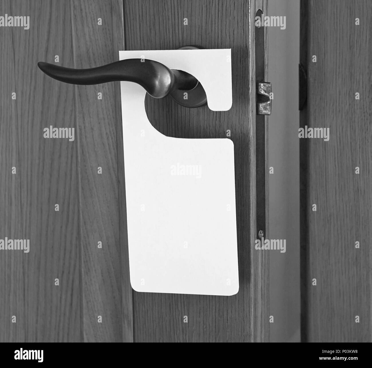 Hotel door handle with blank paper hanger Stock Photo - Alamy