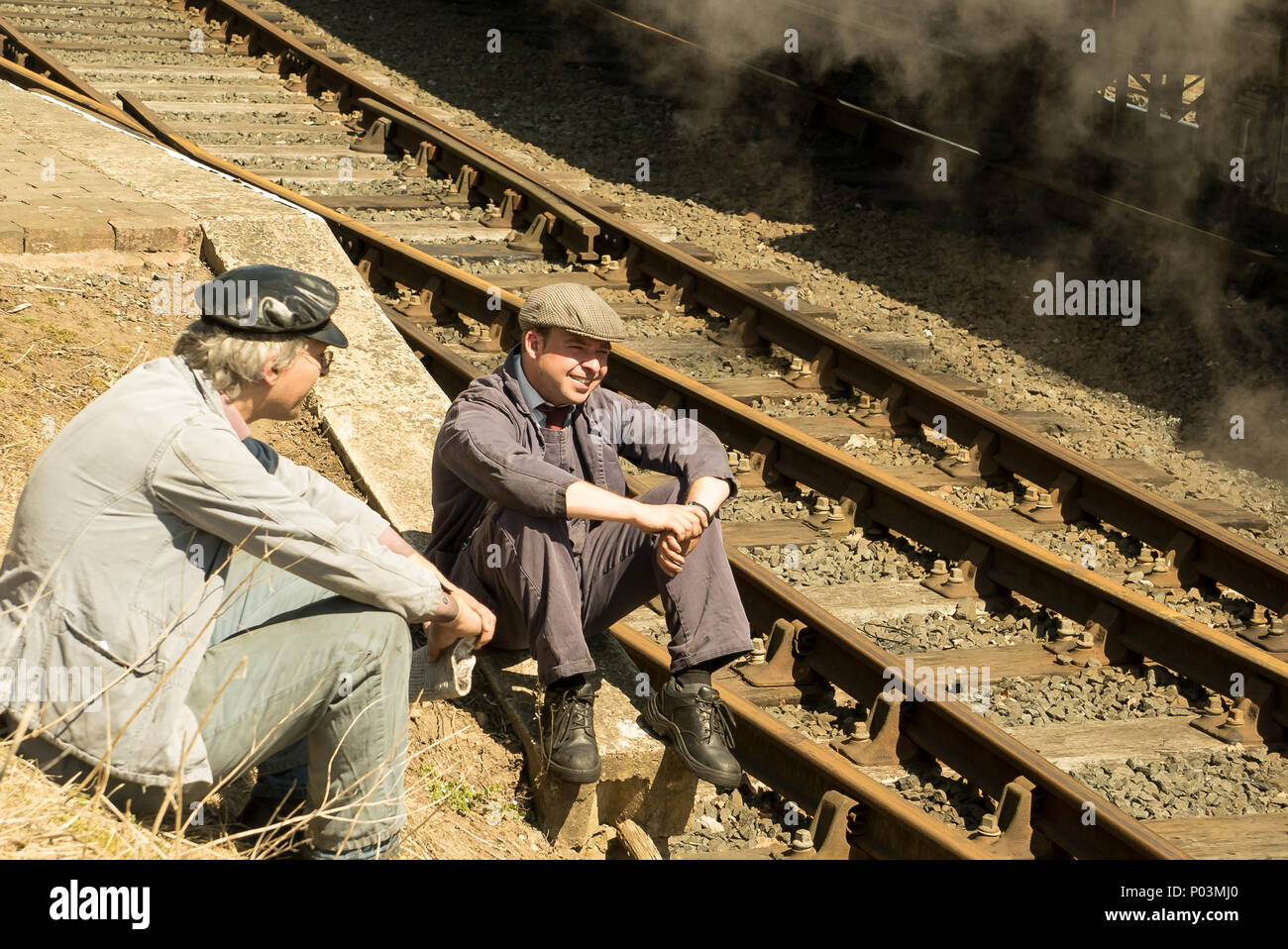 Close up of UK steam train crew (driver & fireman) out of vintage ...