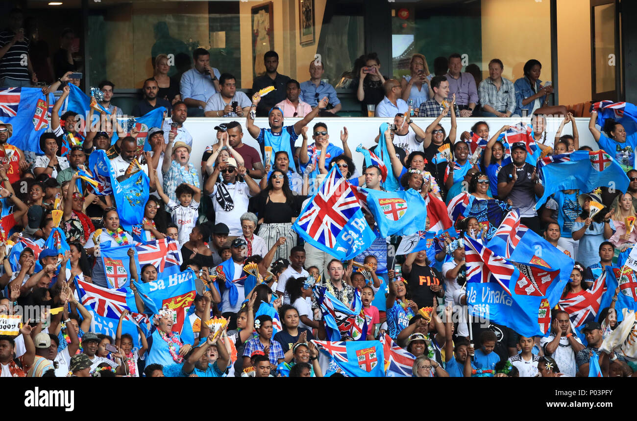 Fans wave flags in the stands Stock Photo - Alamy