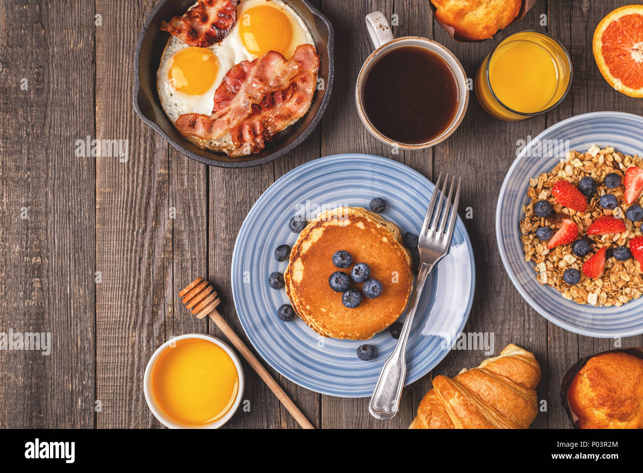 Delicious breakfast on a rustic table. Top view, copy space Stock Photo ...