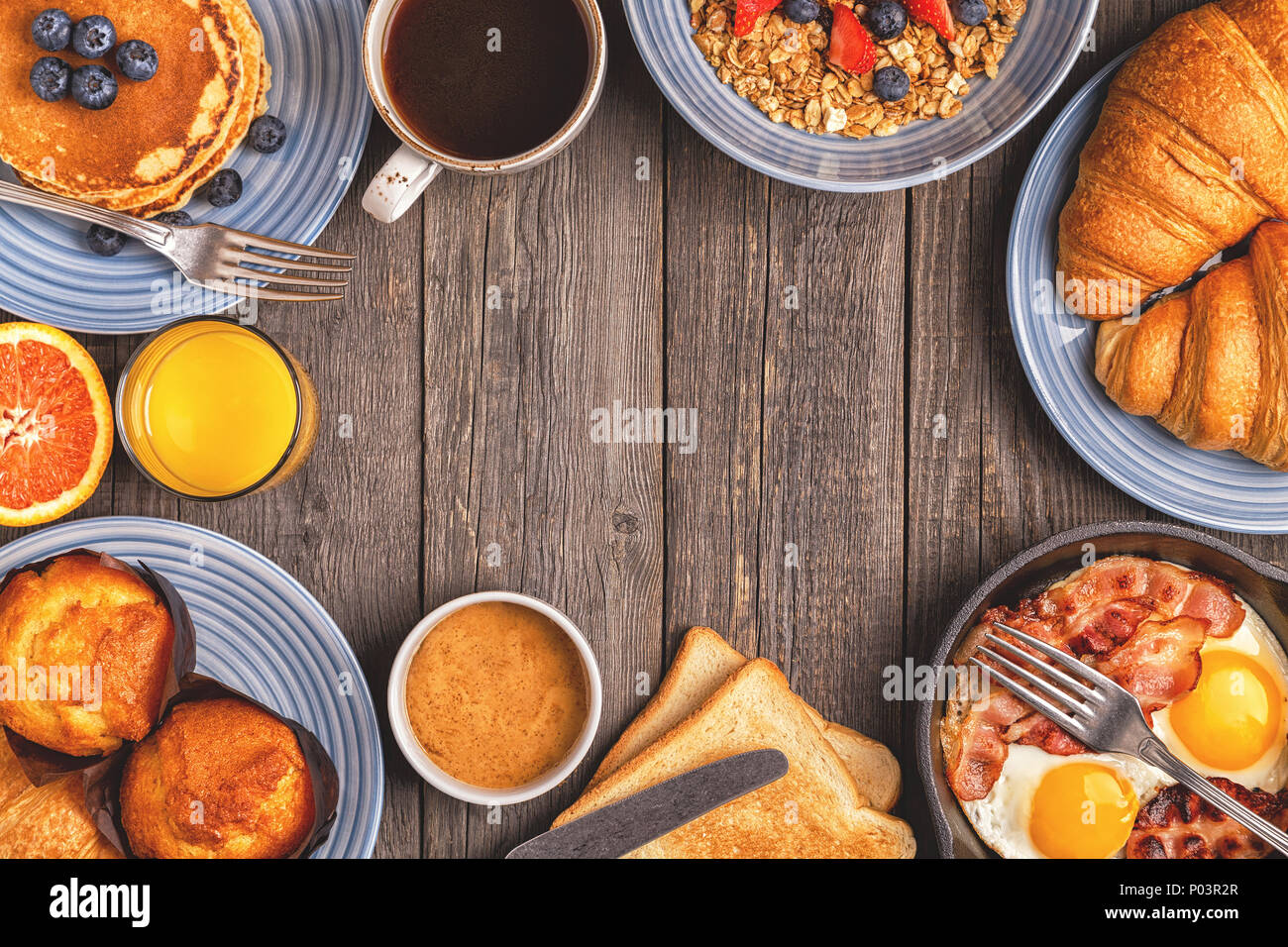 Delicious breakfast on a rustic table. Top view, copy space Stock Photo ...