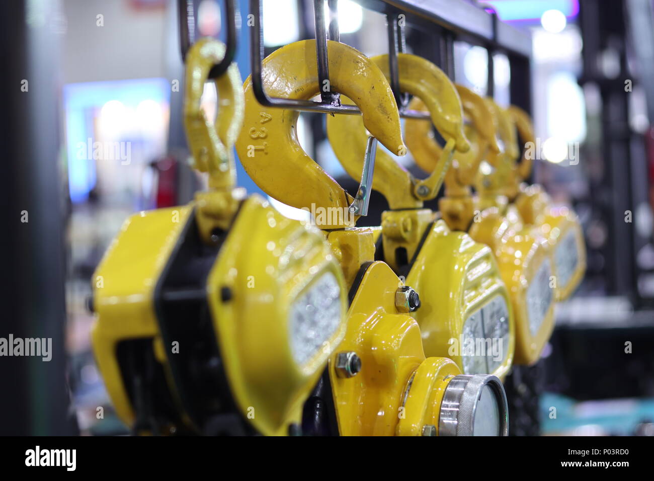 Industrial Steel Chains in yellow hoists ; Selective focus Stock Photo ...