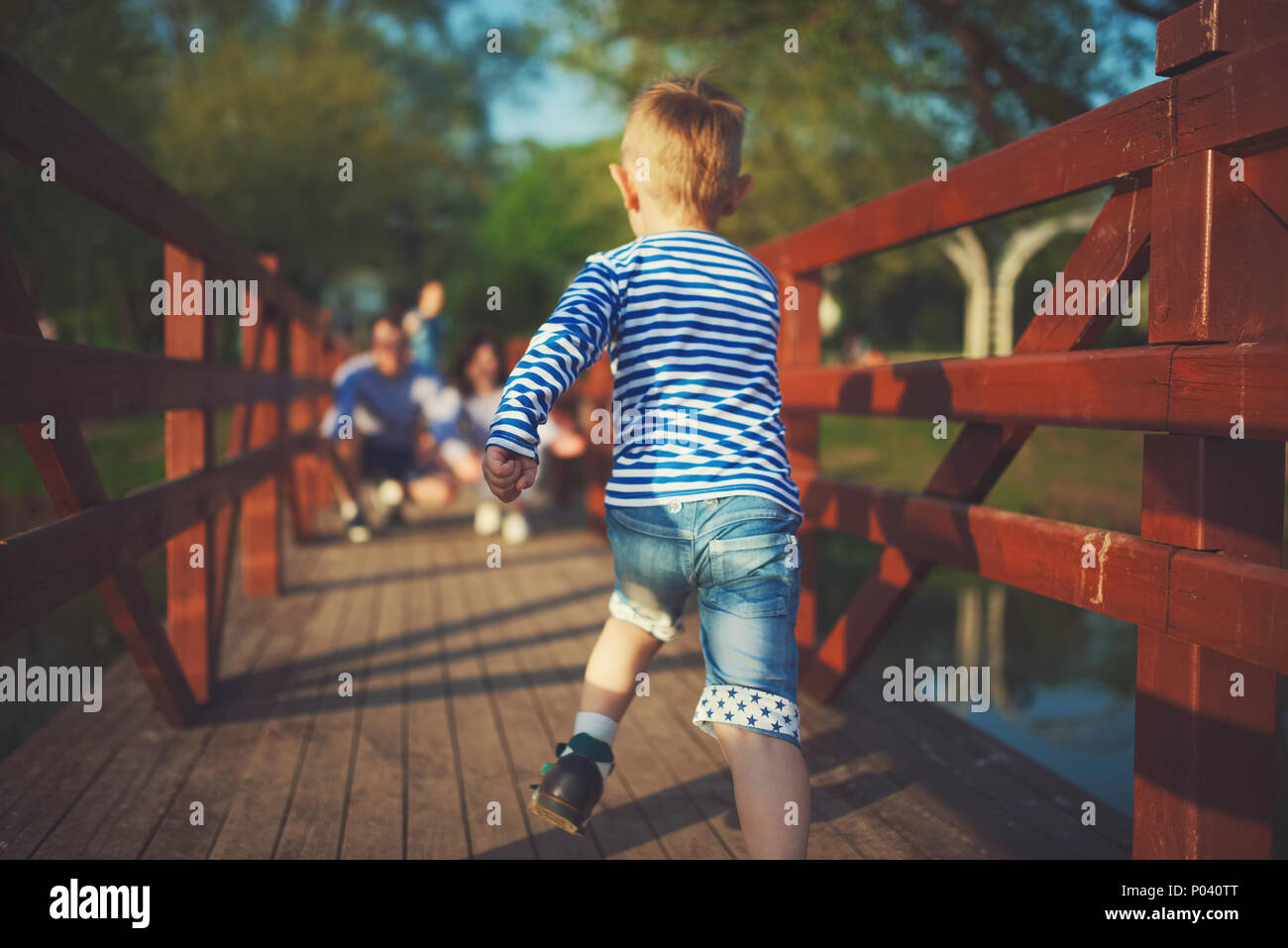 Boy running on bridge hi-res stock photography and images - Alamy