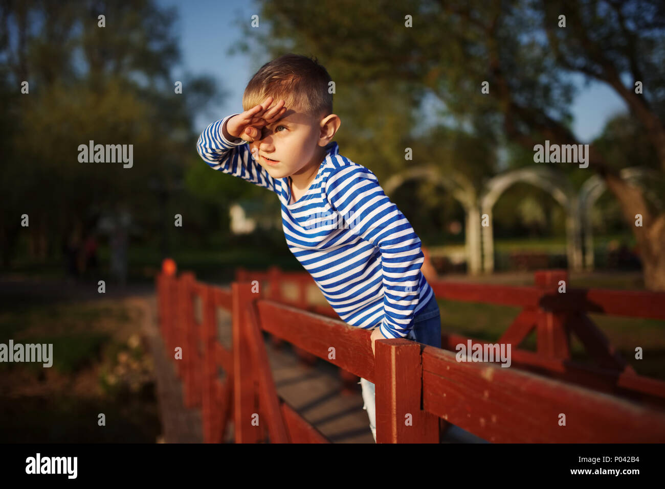 little boy looks into the distance Stock Photo - Alamy