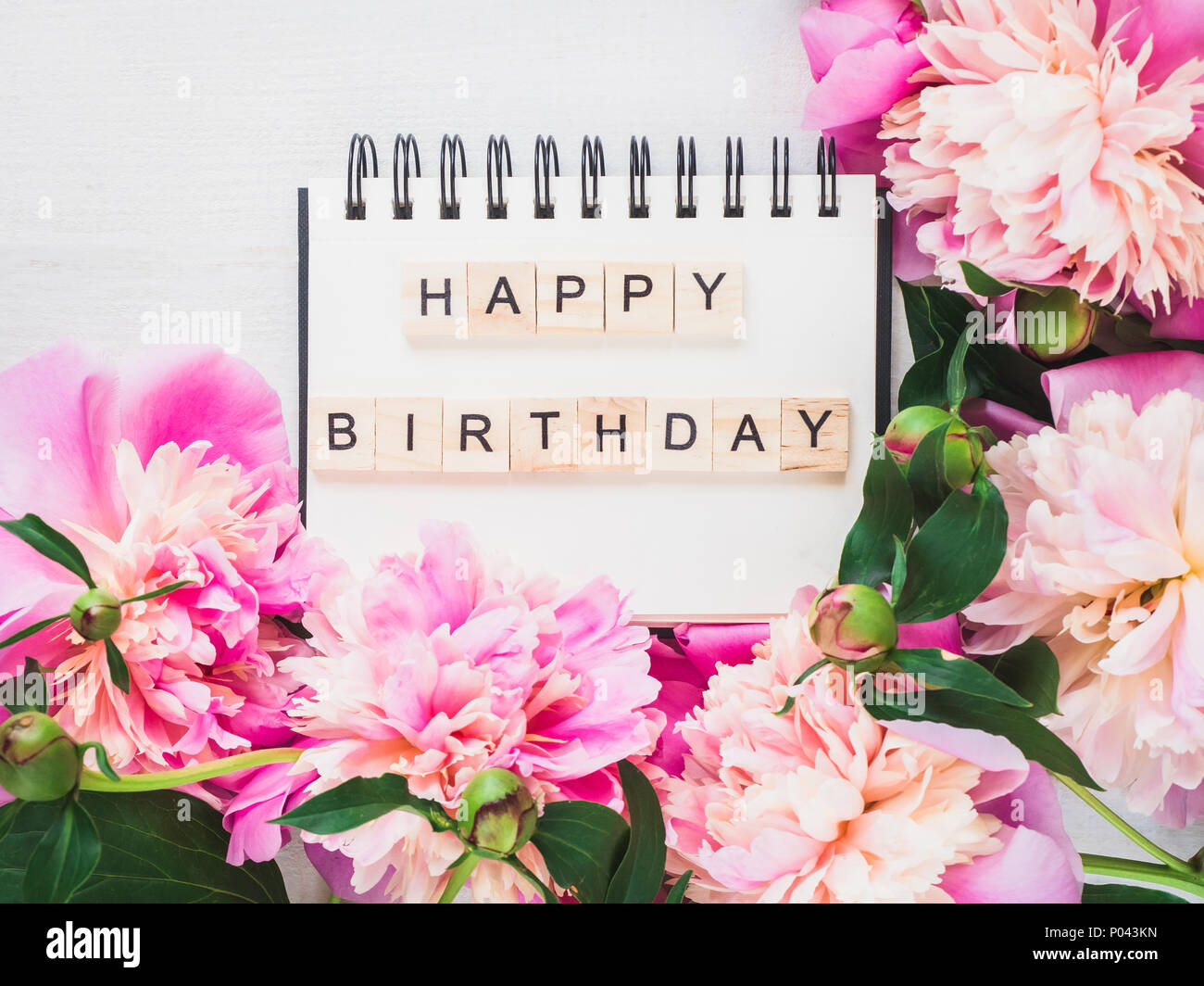 Blank notebook page with birthday greetings on the background of the ...