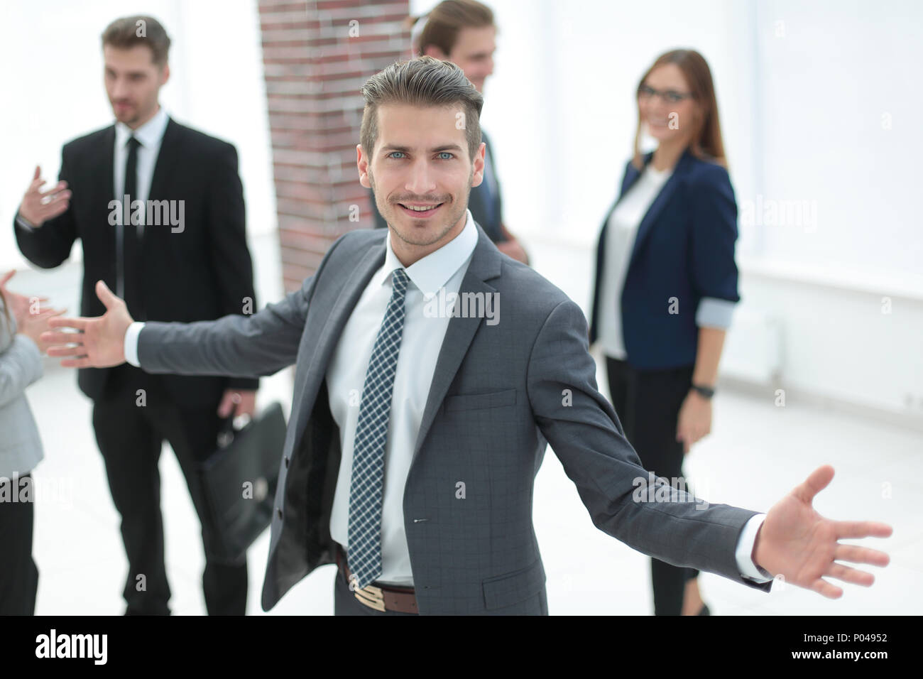 Successful business man with open arms Stock Photo - Alamy