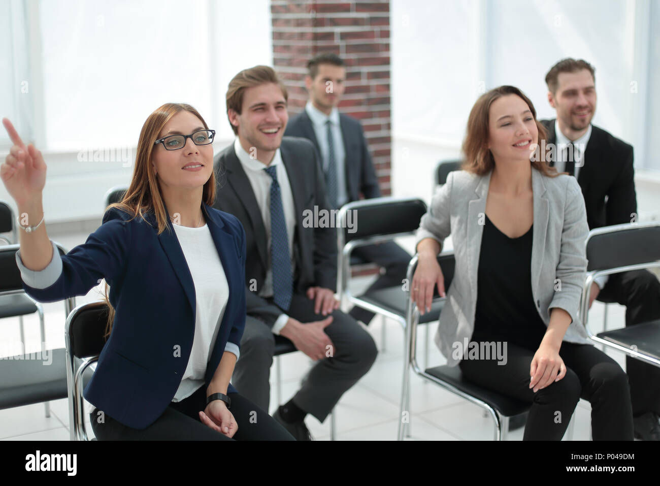 Beautiful business woman is speaking on conference Stock Photo - Alamy