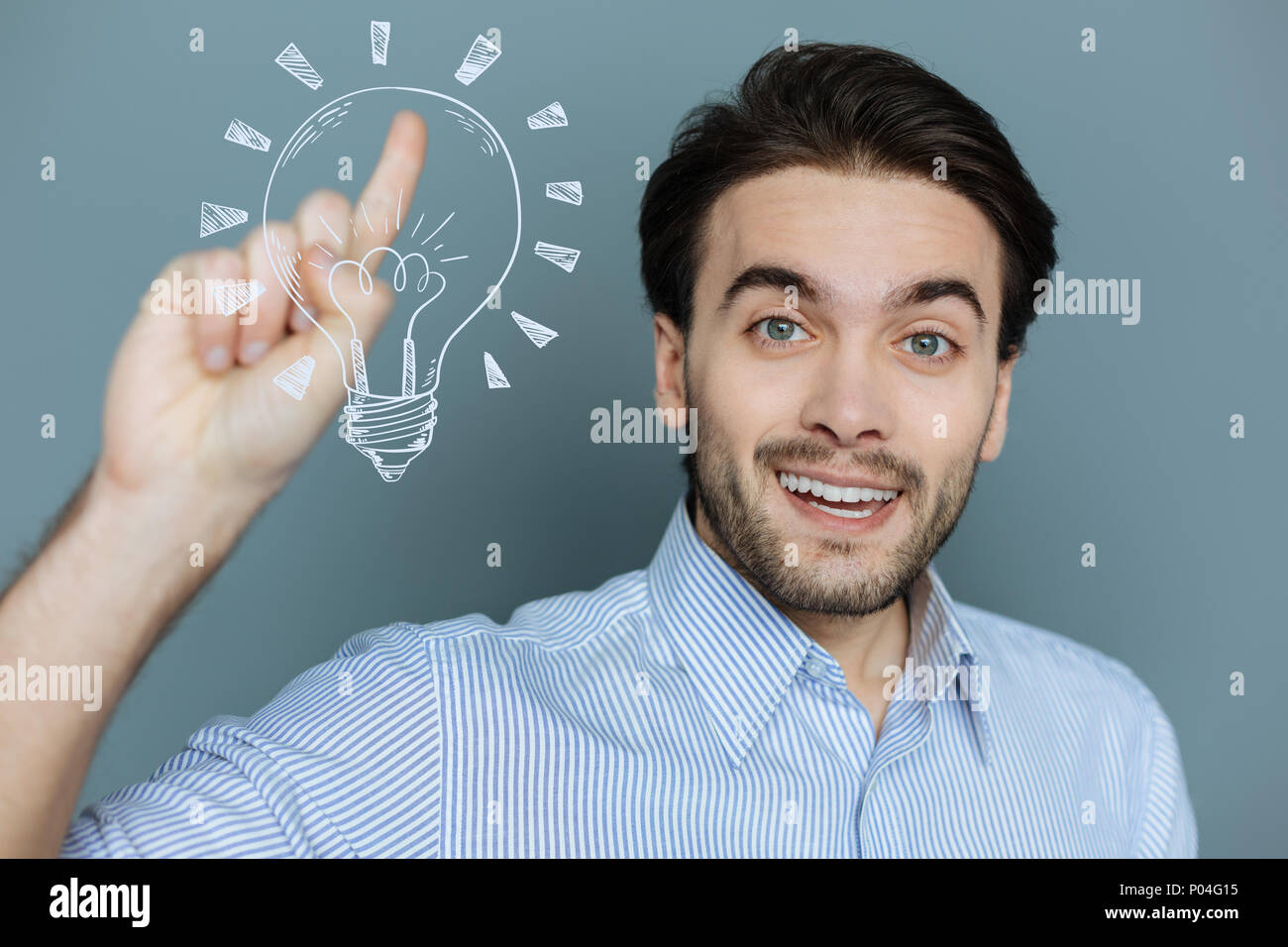 Creative web developer feeling happy while getting an unusual idea ...