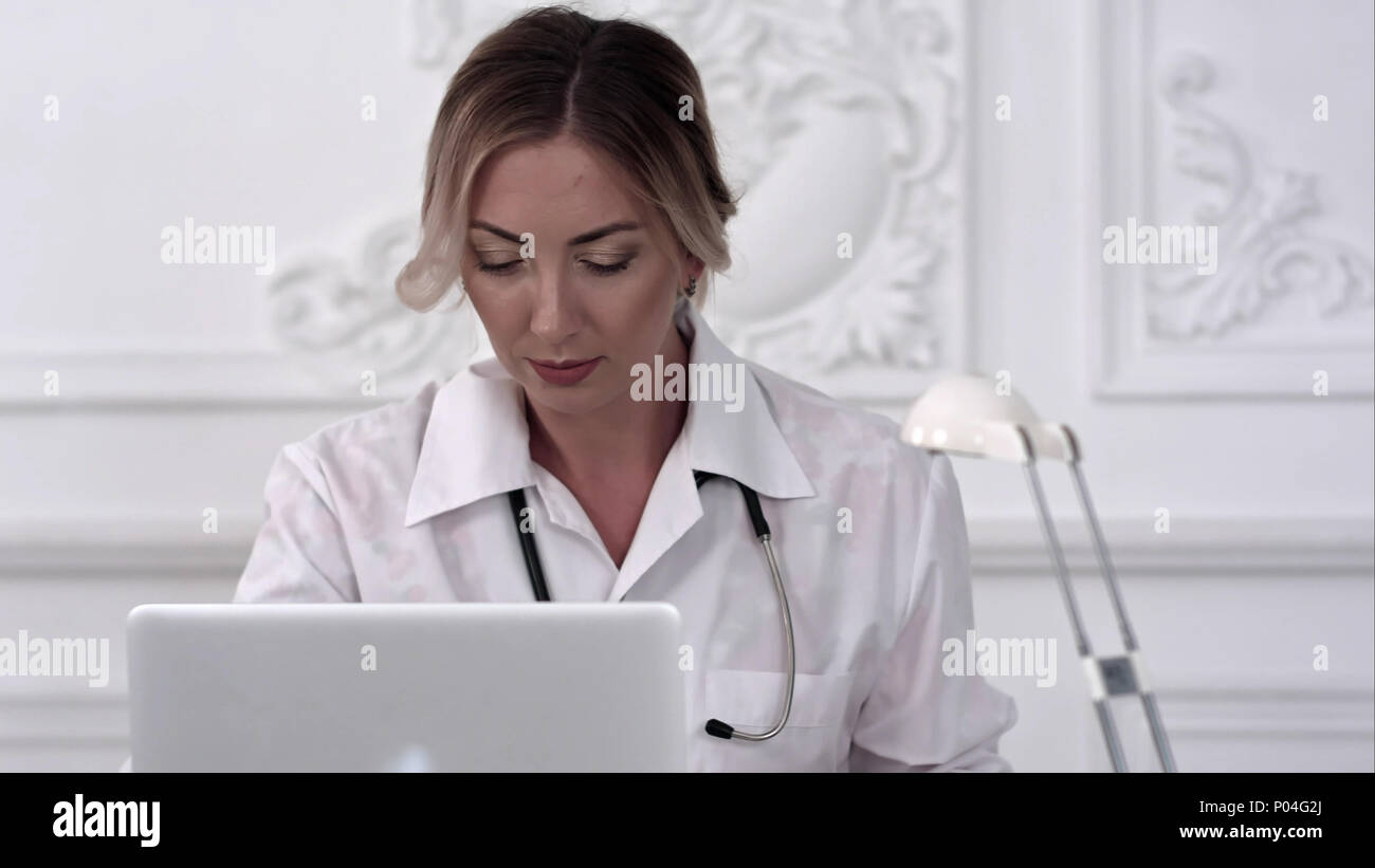 Thoughtful female doctor using hi-res stock photography and images - Alamy