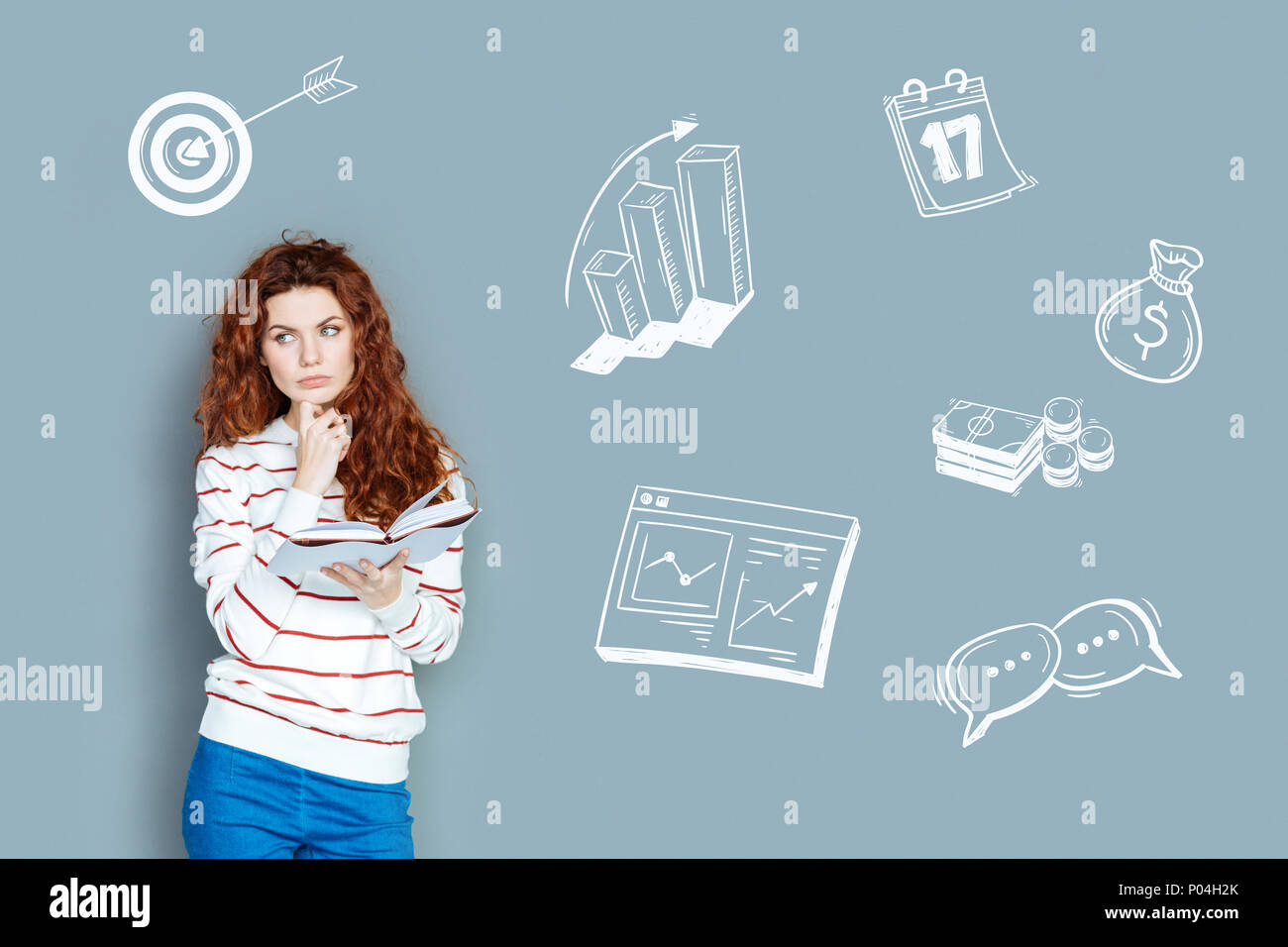 Busy secretary reading a book and thinking about work Stock Photo - Alamy
