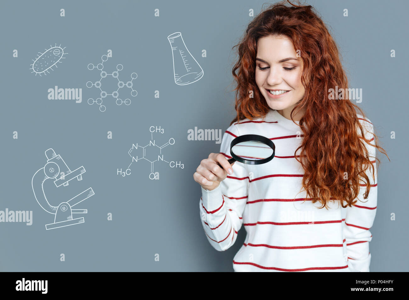 Happy student smiling and enjoying scientific experiments Stock Photo ...