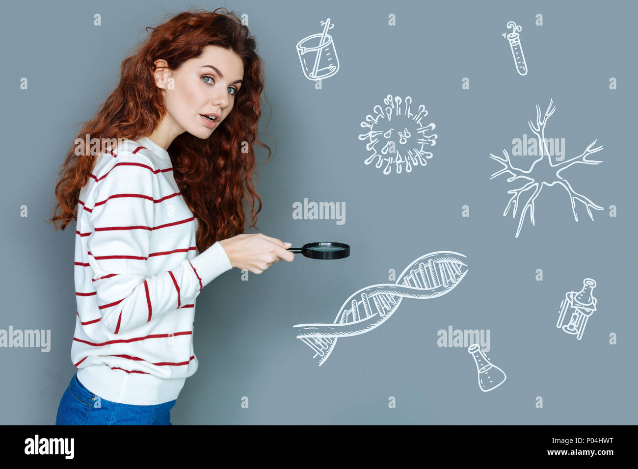 Curious student studying cells and looking interested Stock Photo - Alamy