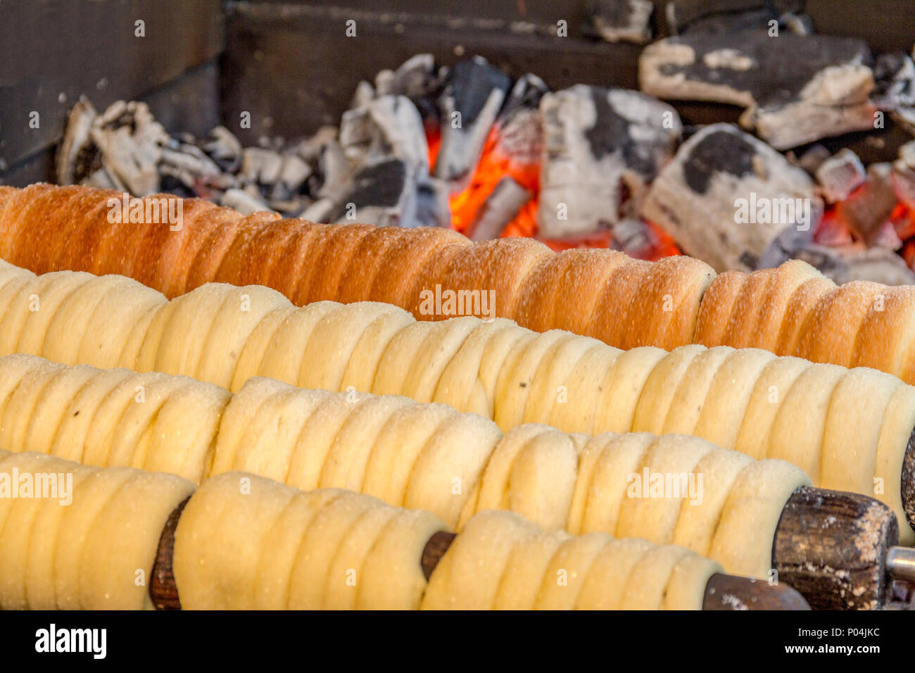 mostly central european spit cake speciality named Trdelnik rotating on ...