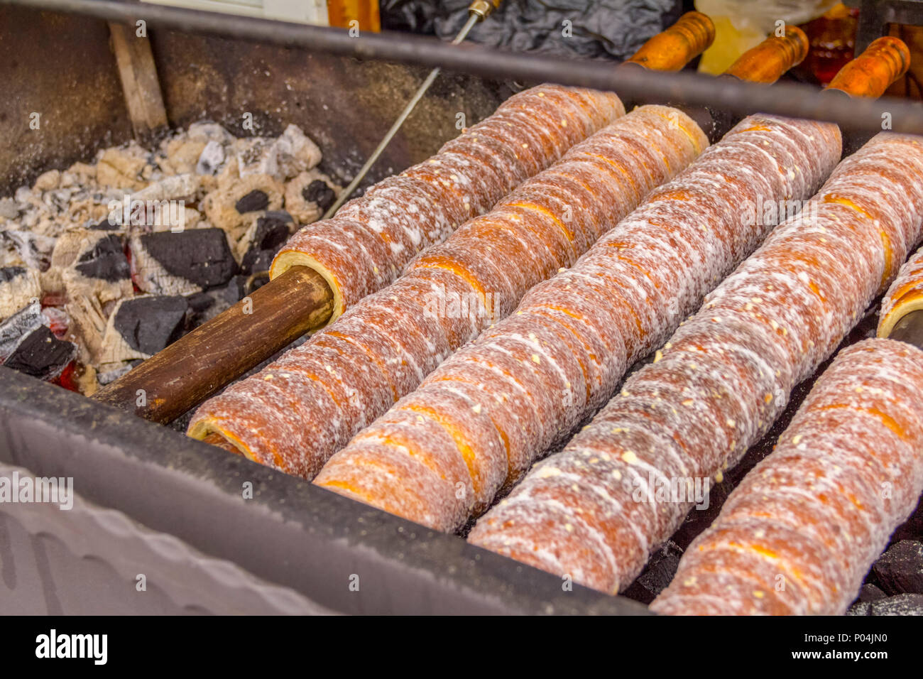 mostly central european spit cake speciality named Trdelnik rotating on ...
