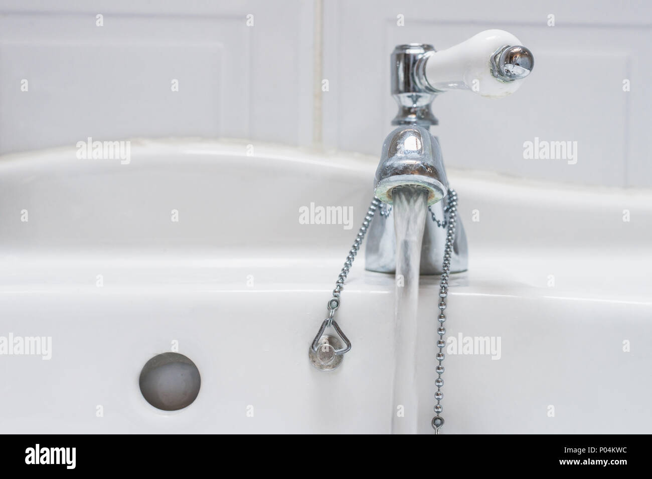 Bathroom basin tap Stock Photo - Alamy