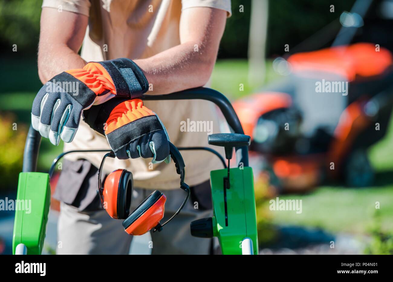 Landscaping Contractor Work. Caucasian Gardener with His Equipment ...
