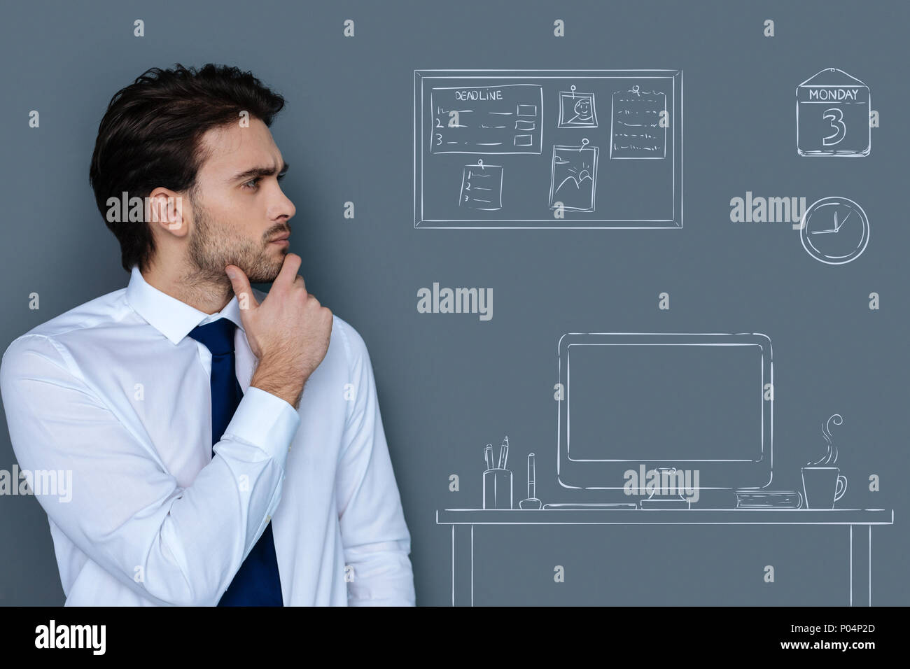 Curious programmer looking at his workplace and thinking Stock Photo ...