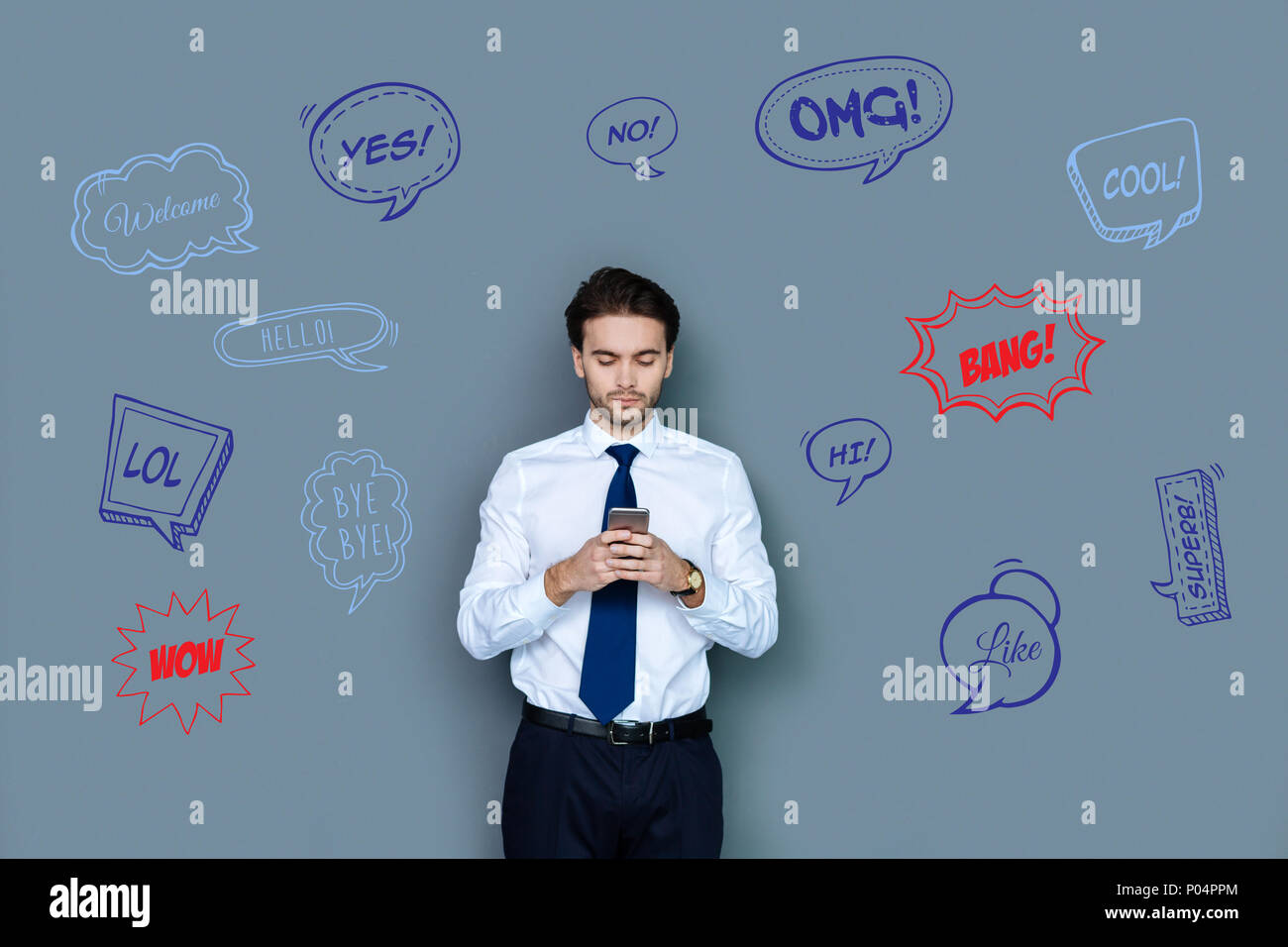 Serious web developer typing messages and looking busy Stock Photo - Alamy