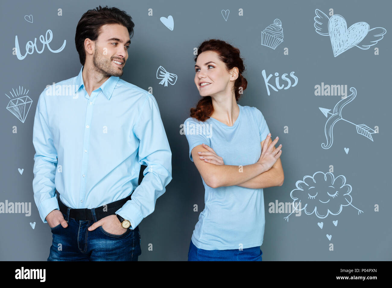 Attractive man looking at his girlfriend and smiling Stock Photo - Alamy