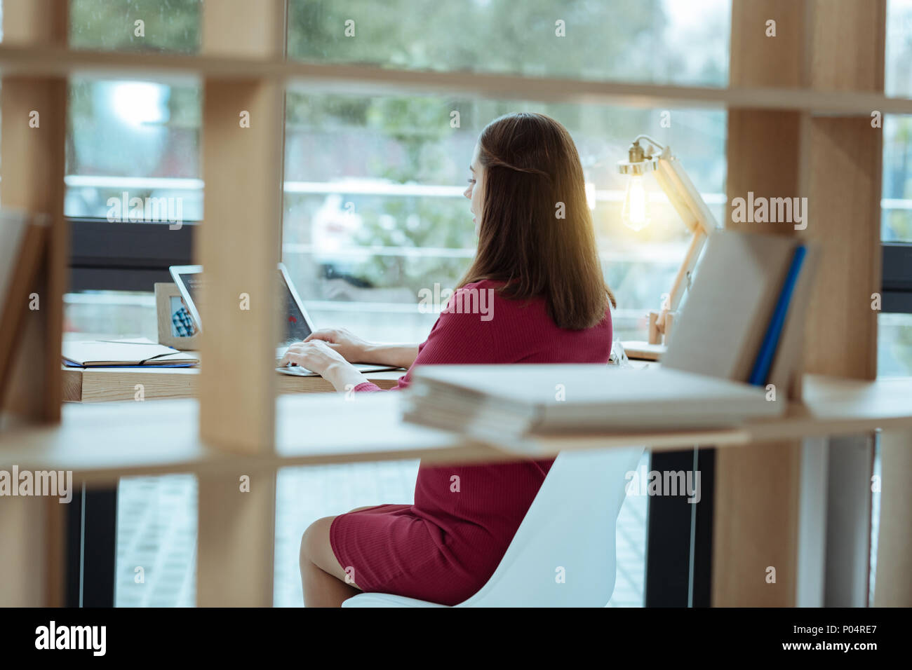Back view of serious woman that being at work Stock Photo - Alamy