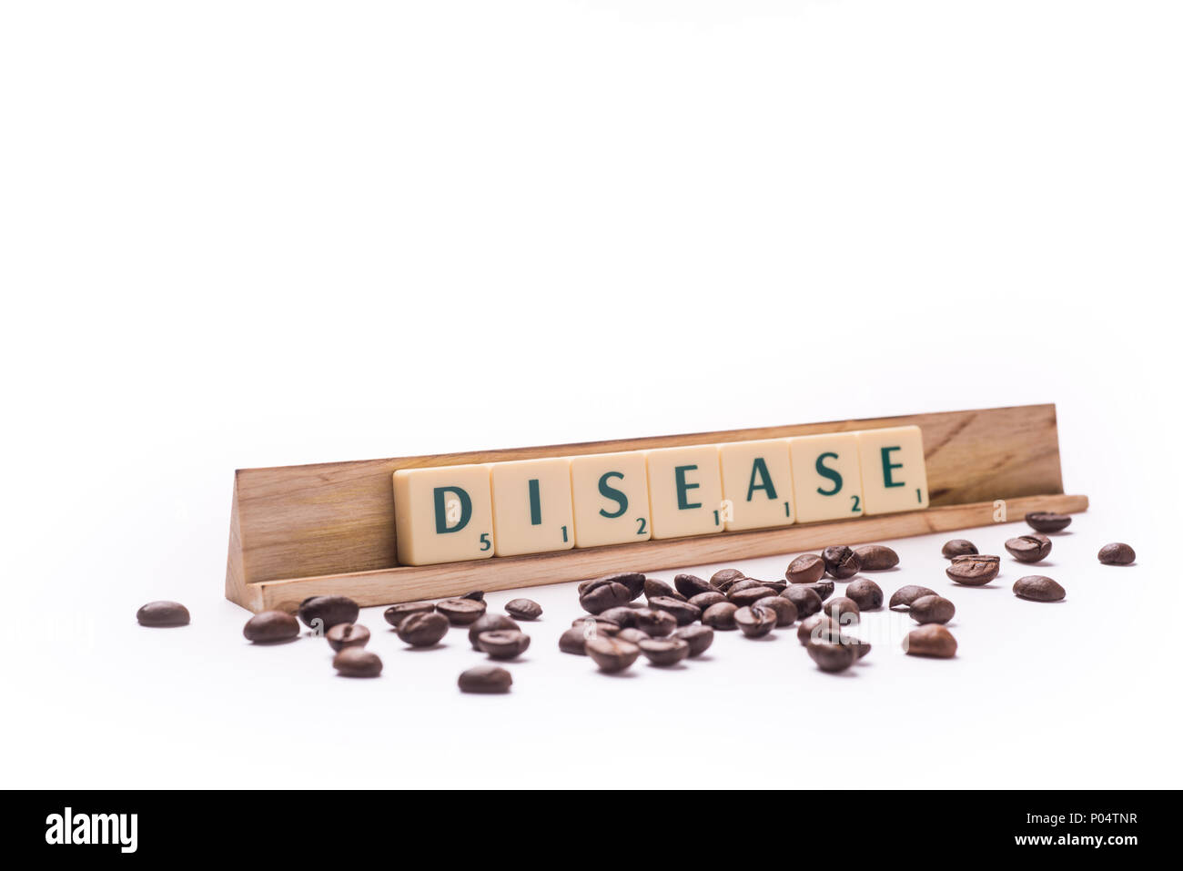 disease written with scrabble letters on a white background composition ...