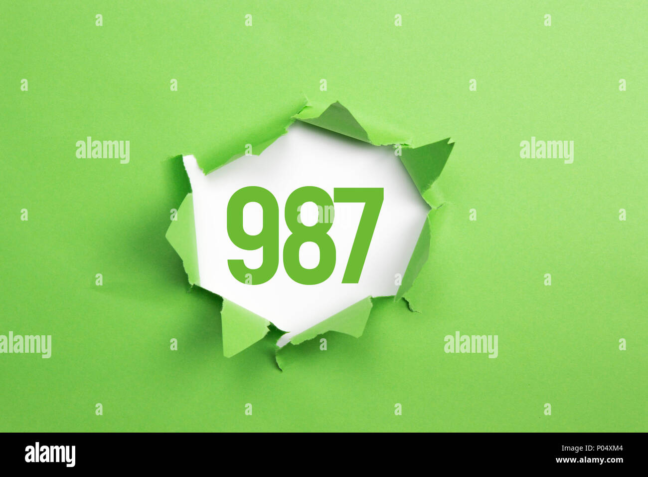 Green Number 987 on green paper background Stock Photo - Alamy