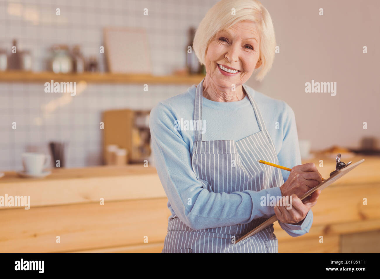 Selective focus cheerful barista hi-res stock photography and images ...
