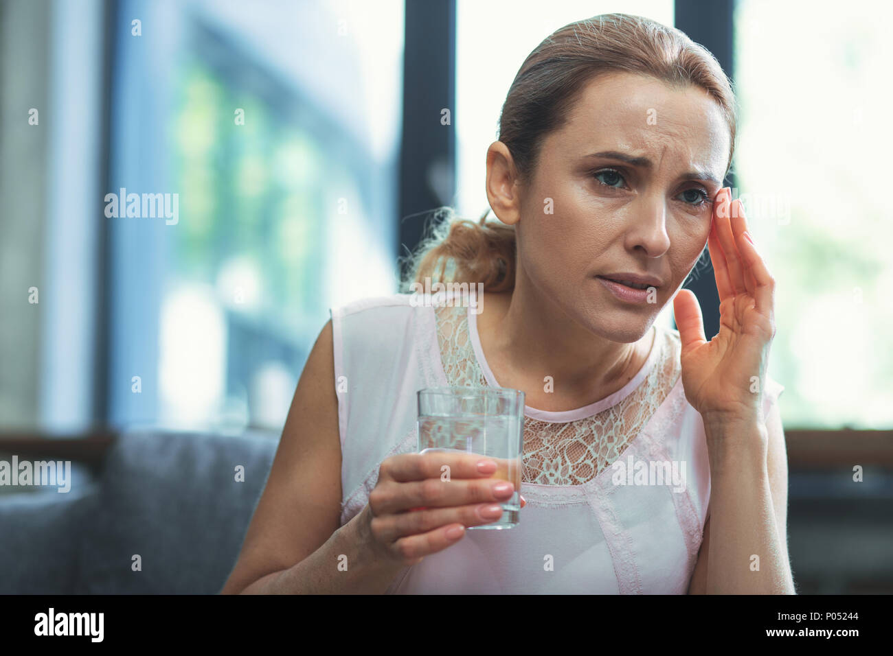 Restless mature woman undergoing stress Stock Photo - Alamy