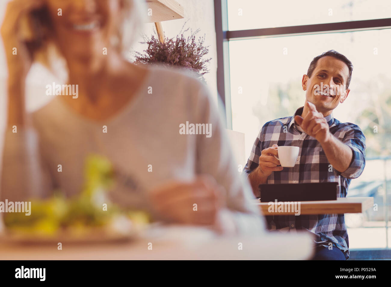Restaurant customer calling waiter hi-res stock photography and images ...