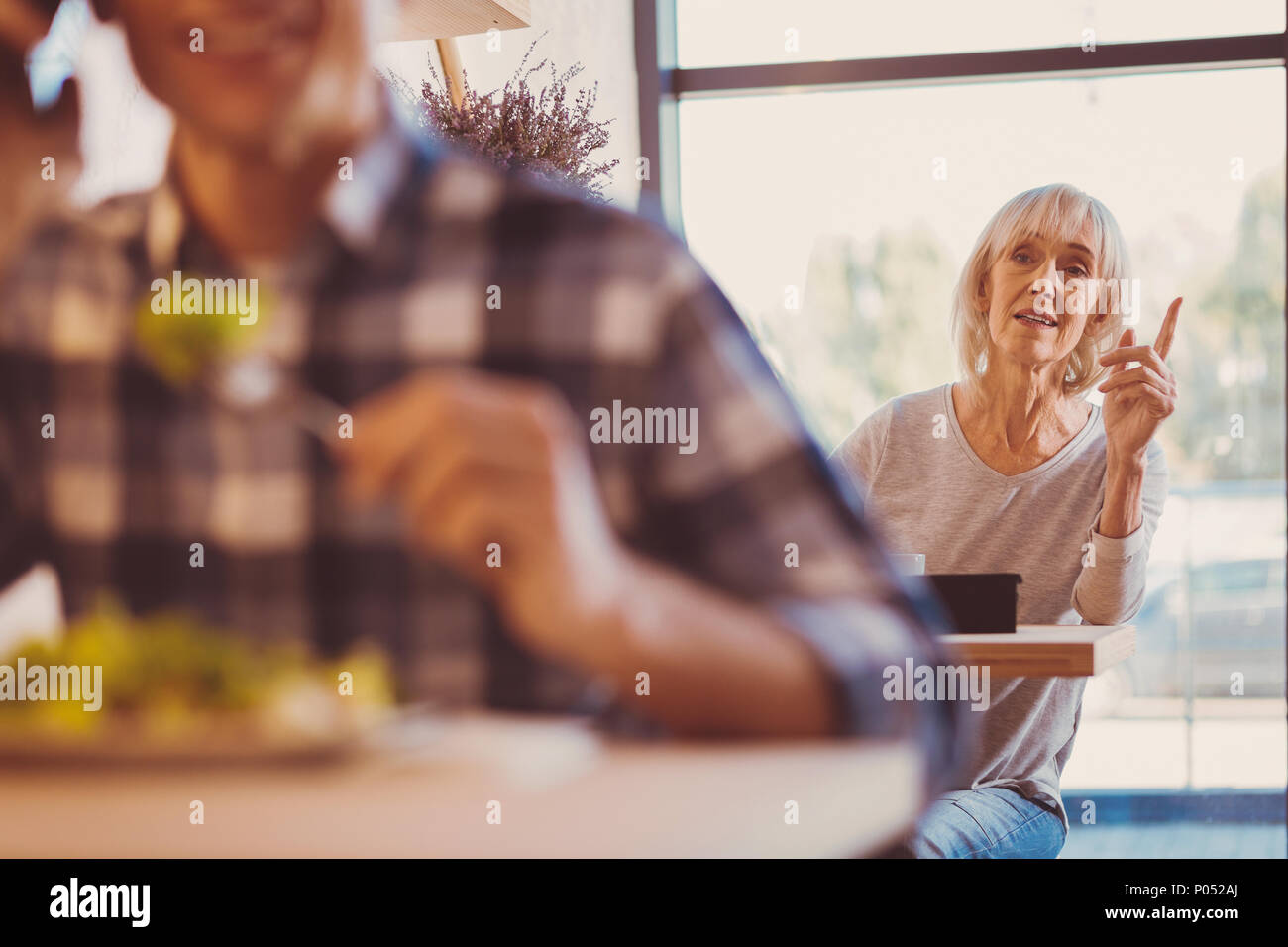 Restaurant customer calling waiter hi-res stock photography and images ...