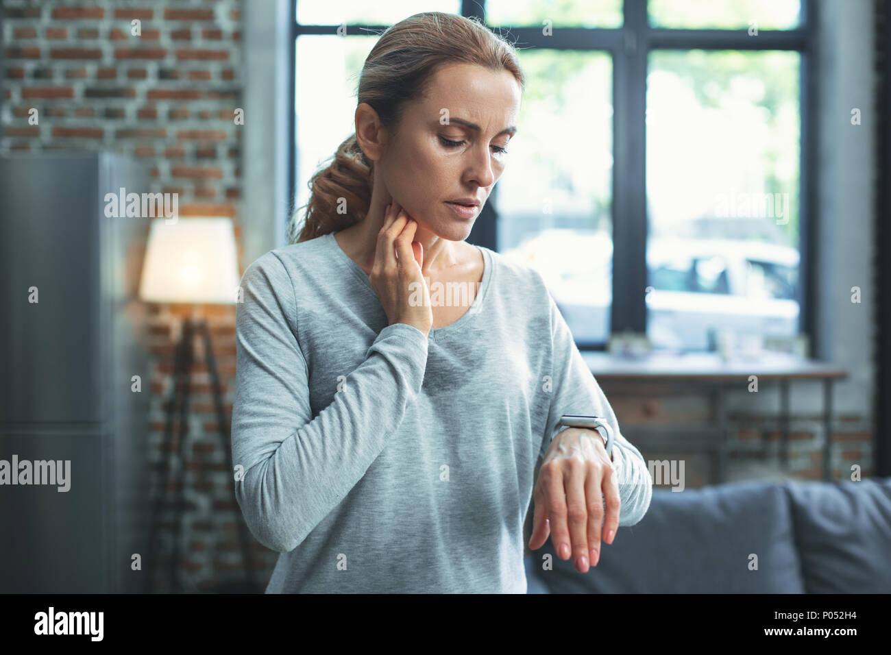 Earnest mature woman checking life signs Stock Photo - Alamy