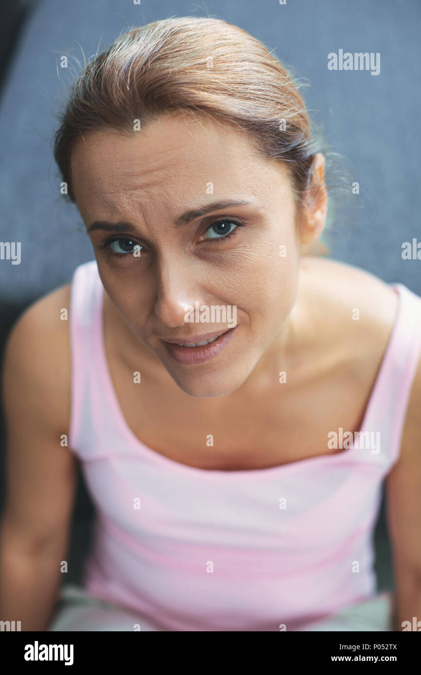 Painful mature woman explaining problem Stock Photo - Alamy