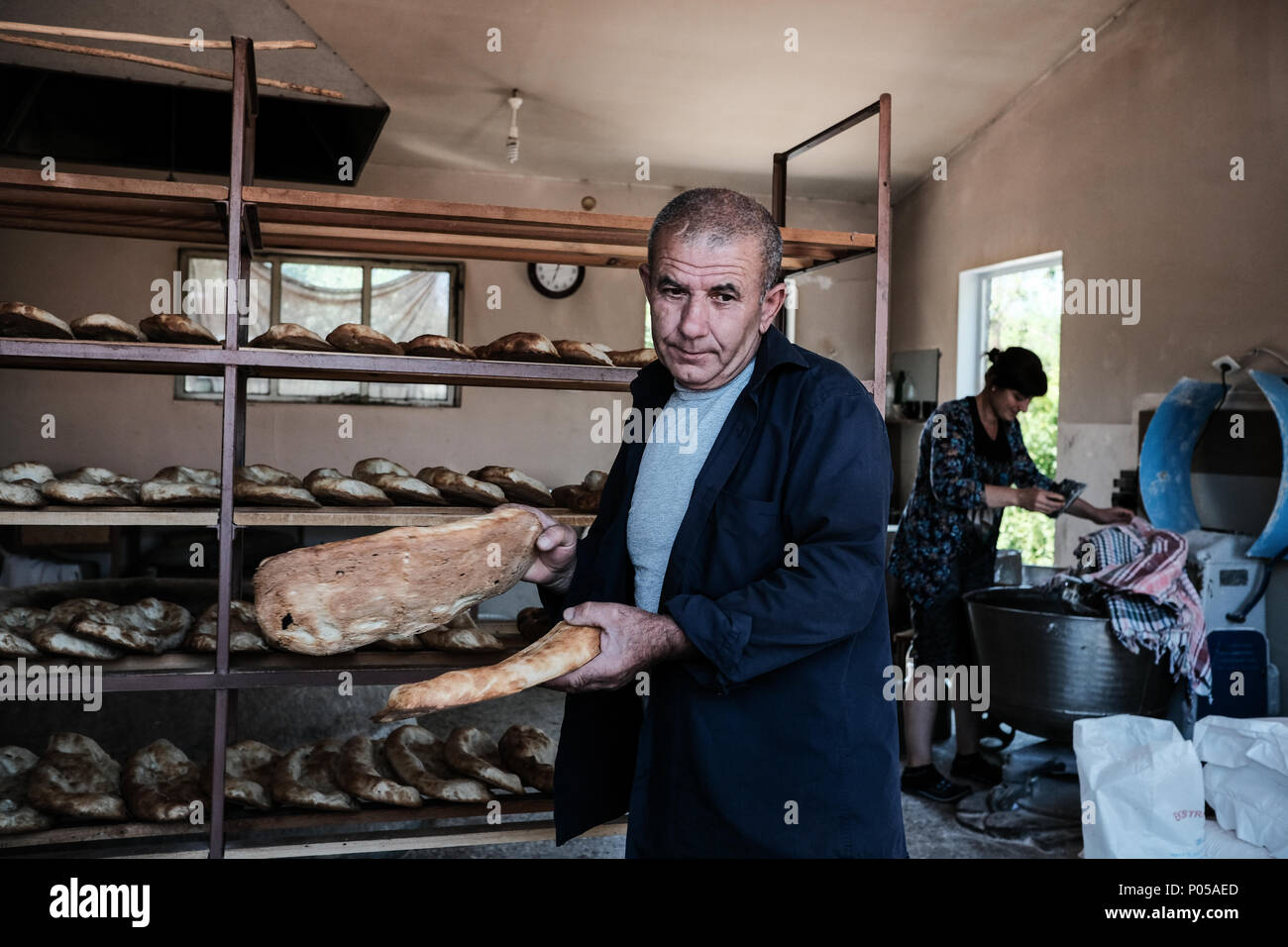 A man sells bread in a roadside bakery Stock Photo - Alamy