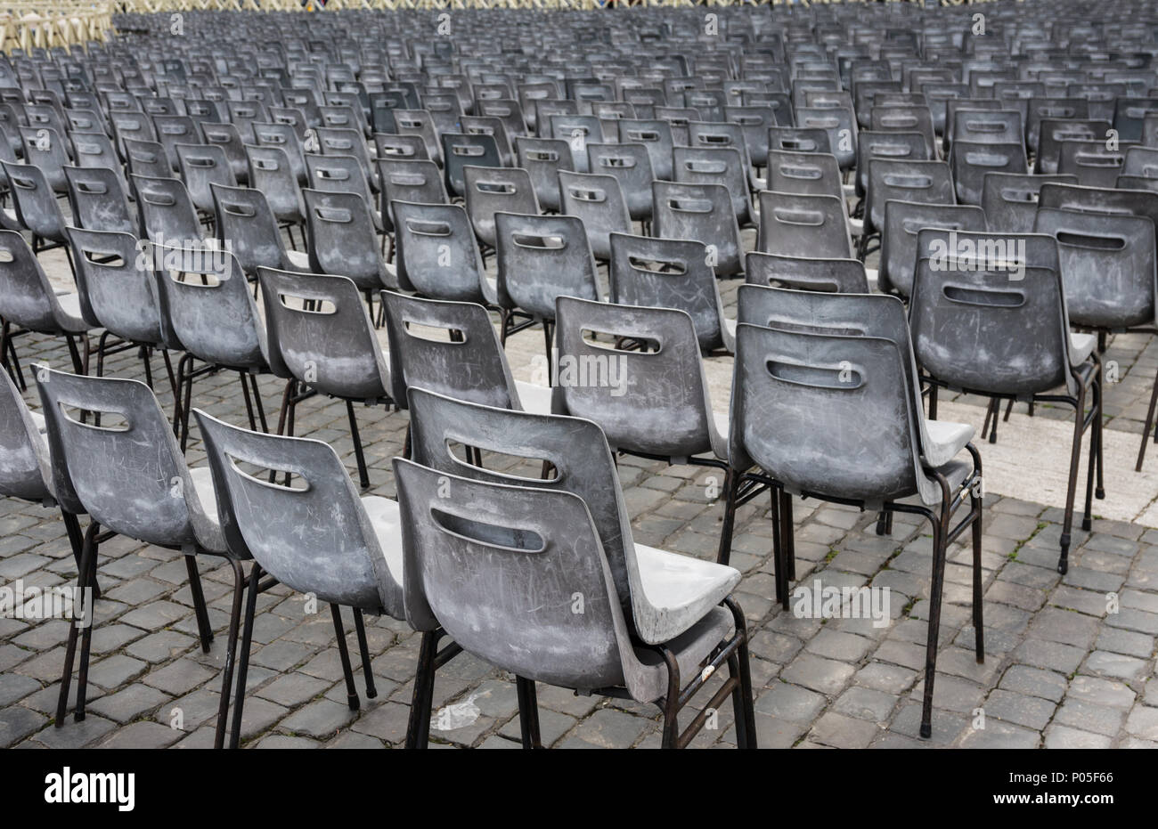 Rows of old empty chairs on square, Vatican Stock Photo - Alamy