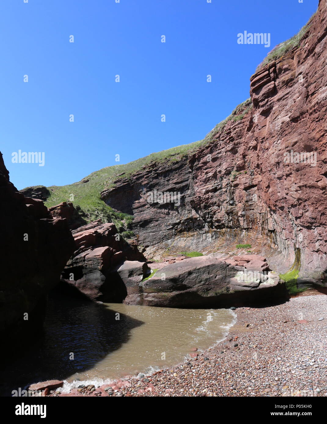 Small enclosed beach with cliff Seaton Cliffs Angus Scotland June 2018 ...