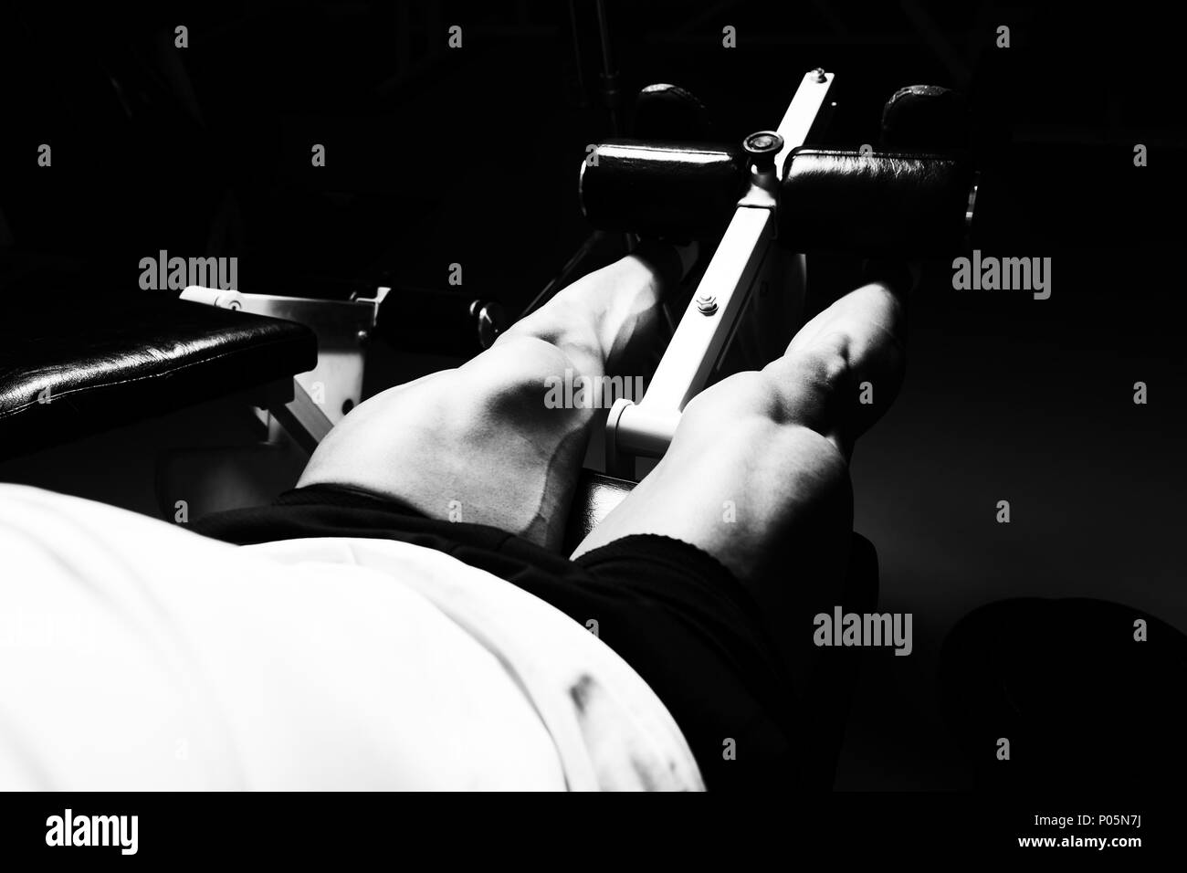 Leg Exercises Close Up - Man Doing Leg With Machine In Gym Stock Photo ...