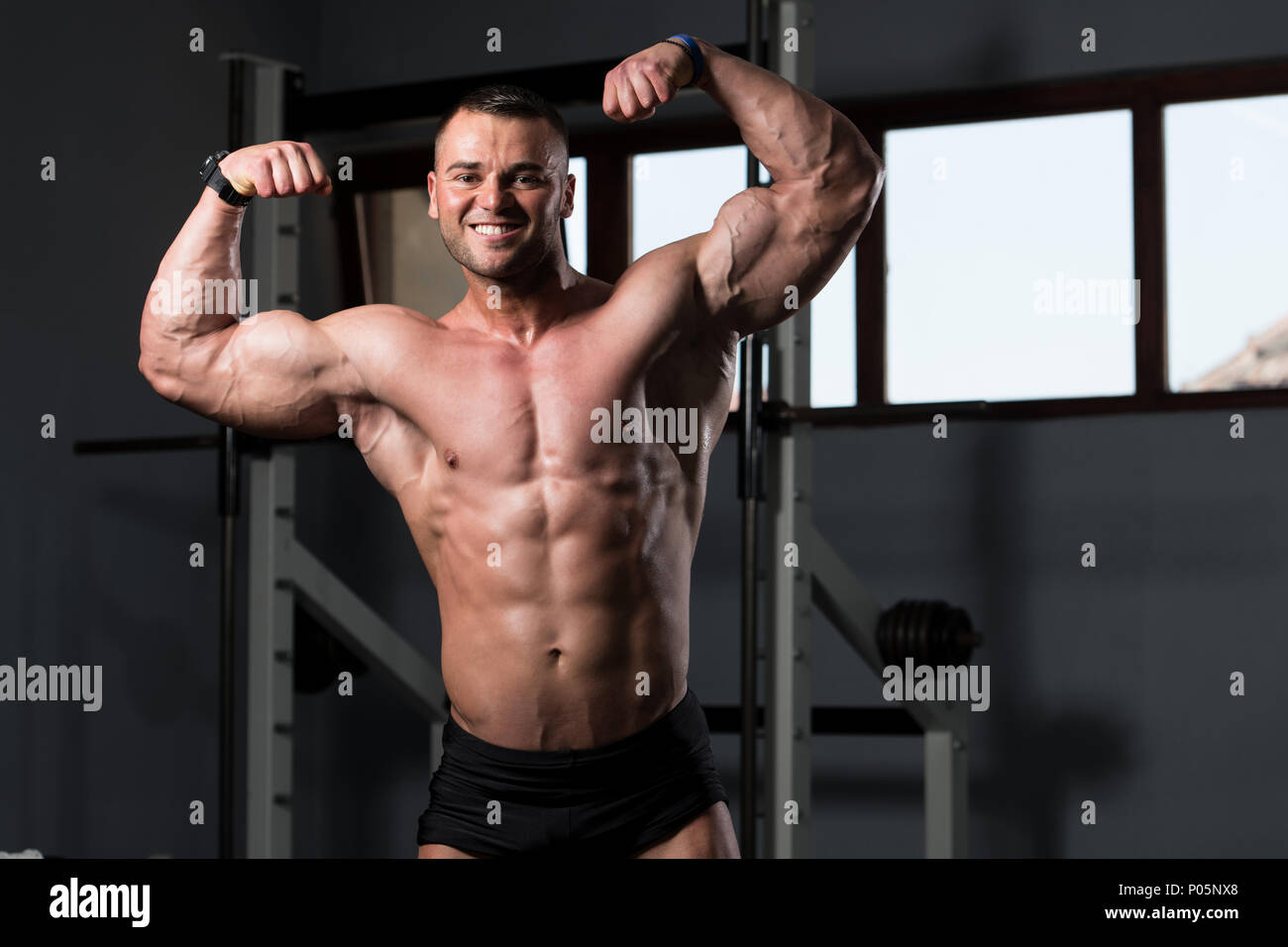 Portrait Of A Young Physically Fit Man Showing His Well Trained Body ...