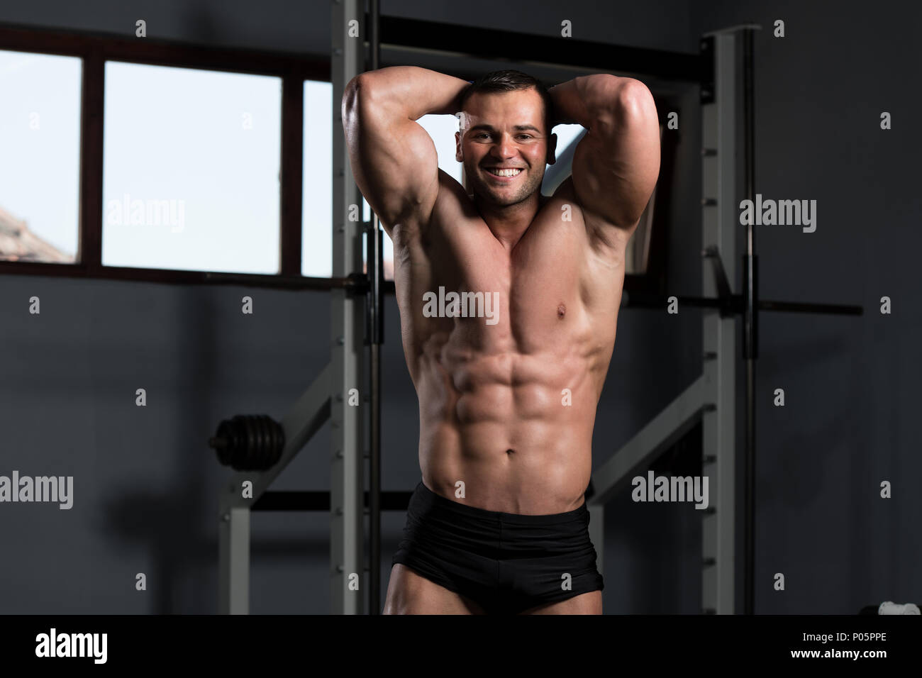 Portrait Of A Young Physically Fit Man Showing His Well Trained Body ...